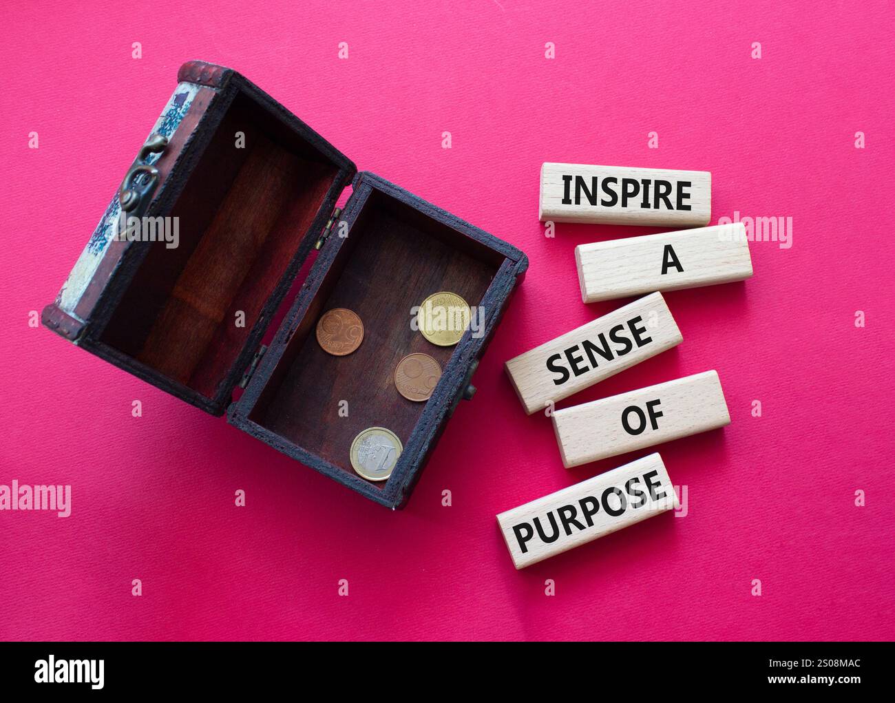 Purpose symbol. Wooden blocks with words Inspire a sense of Purpose ...