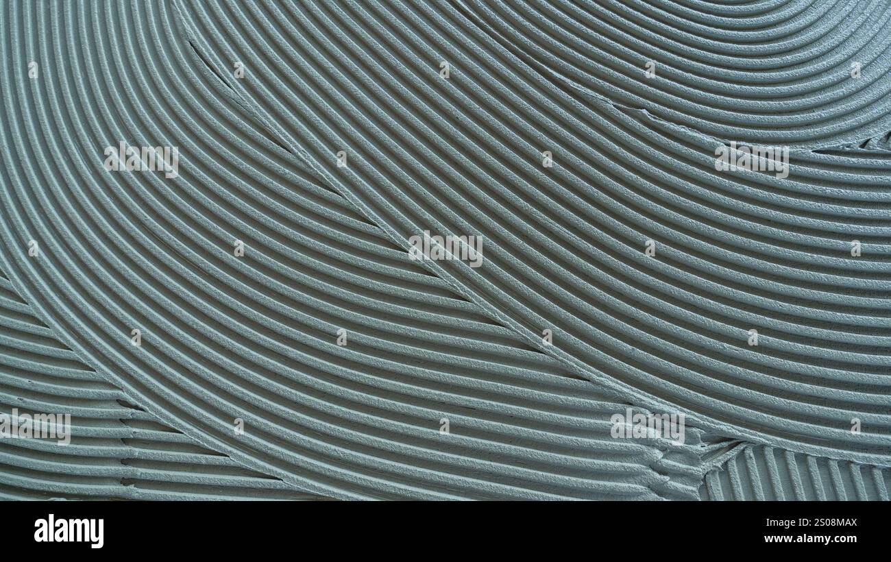 Texture cementitious adhesive applied to the floor ready to receive the ...