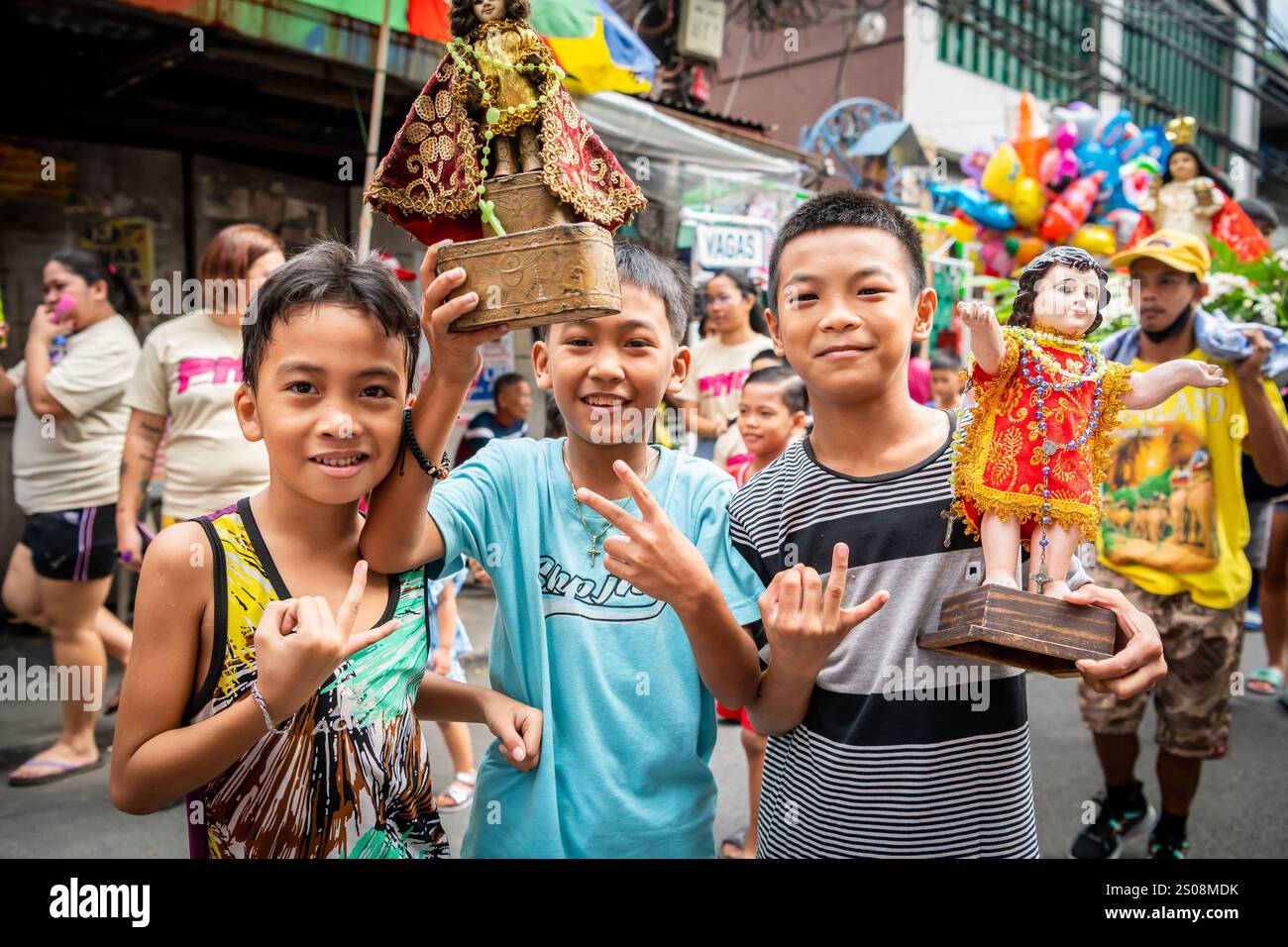 Filipino people celebrate an annual religious festival with a parade ...