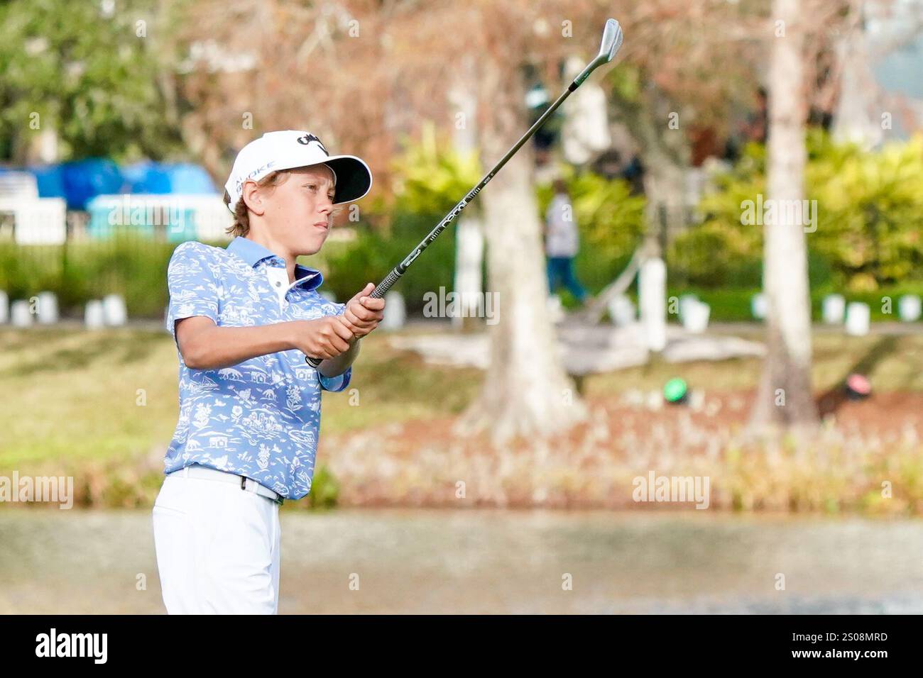 Orlando, Florida, USA. 22nd Dec, 2024. Will McGee chips on to the 18th ...
