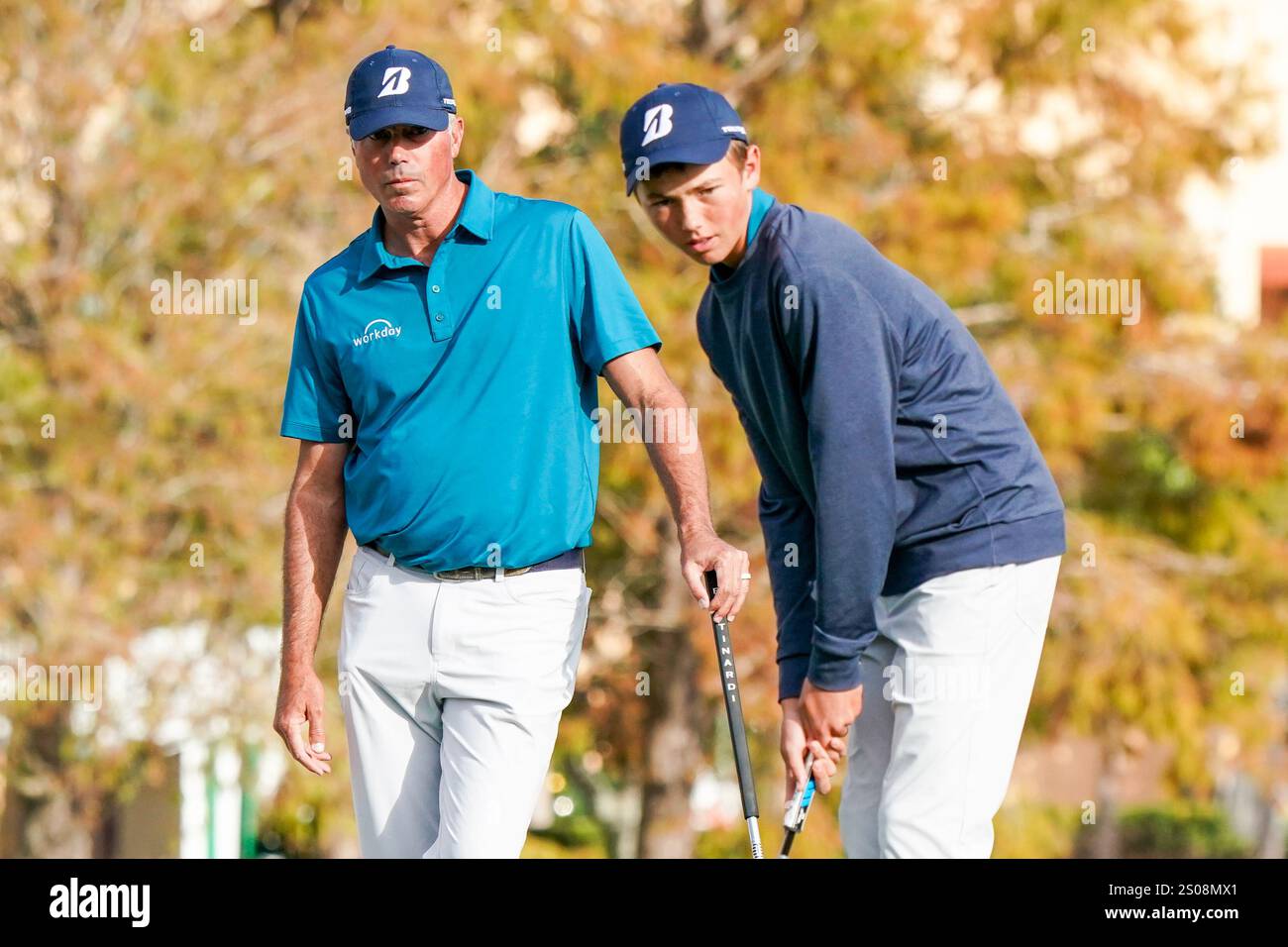 Orlando, Florida, USA. 22nd Dec, 2024. Matt Kuchar (L) and son Carson ...