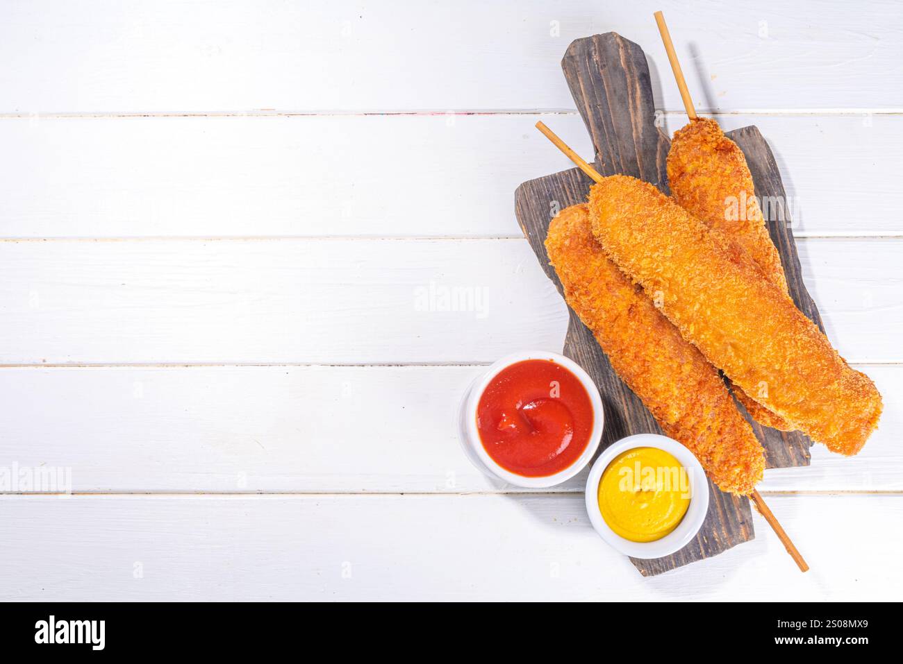 Traditional american, mexican corn dog with sauces - ketchup, mayo ...