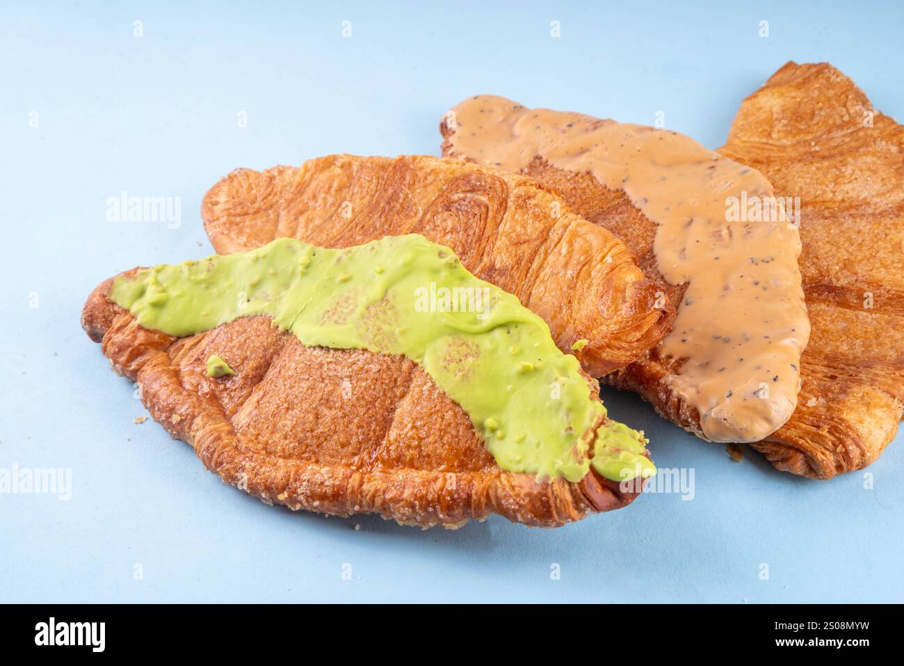 Set of colorful trendy flat croissants with different topping and ...