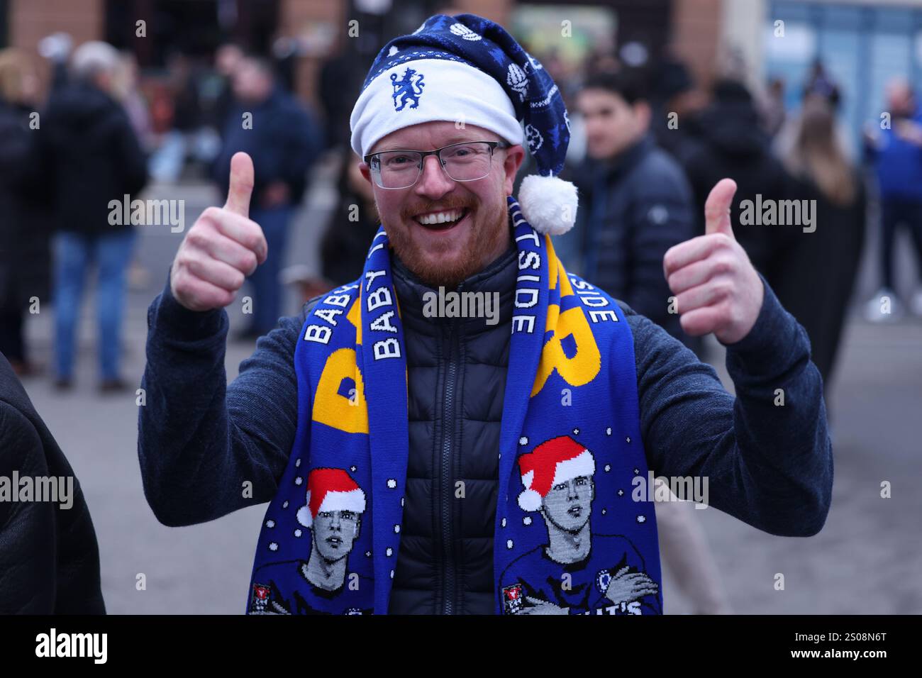 London, England, 26th December 2024. A Chelsea fan wears a Christmas ...