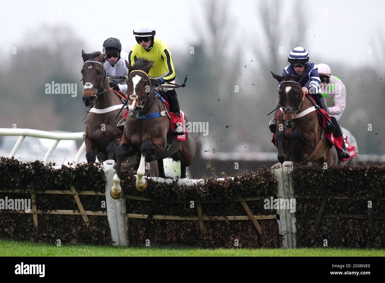 Runners and riders during the first circuit of the Ladbrokes Christmas ...