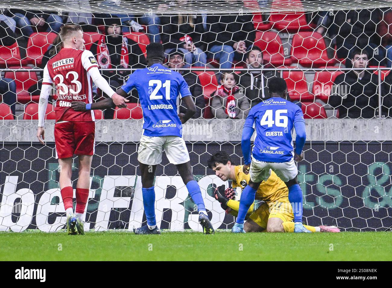 Antwerpen, Belgium. 26th Dec, 2024. Antwerp's goalkeeper Senne Lammens and Genk's Carlos Cuesta ...