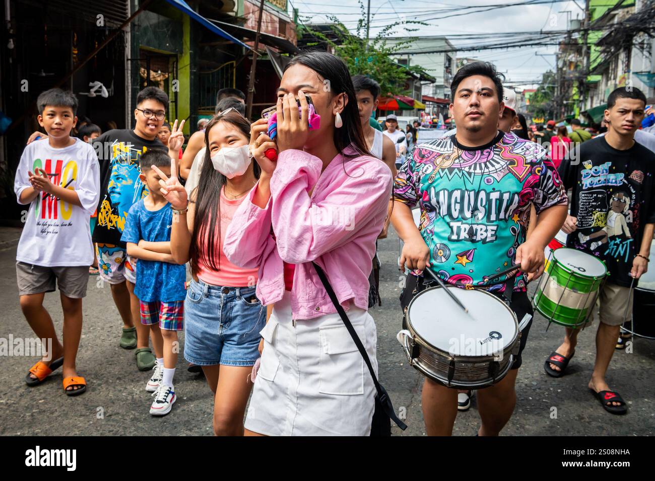 Filipino people celebrate an annual religious festival with a parade ...