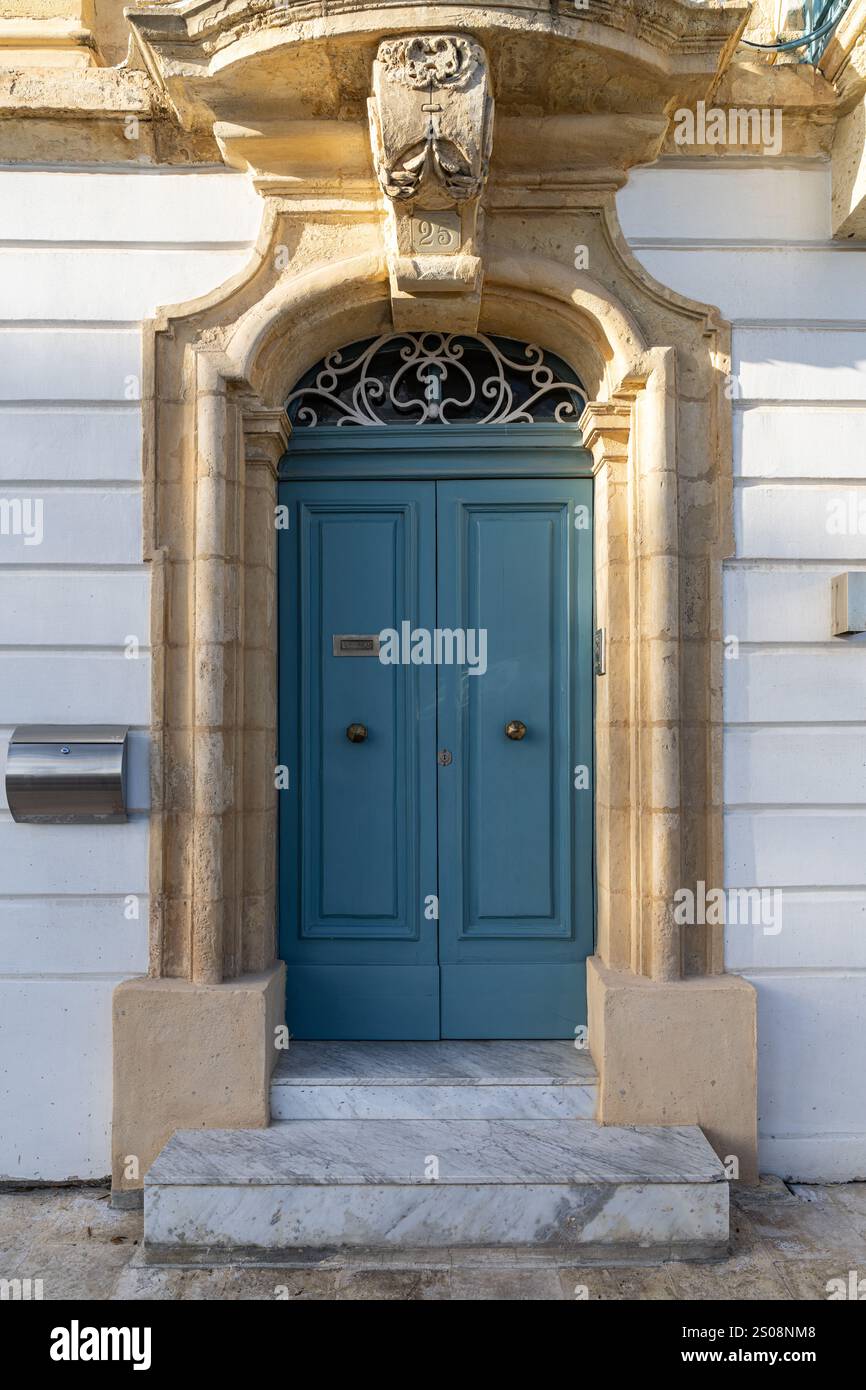Traditional house detail in Malta. Limestone yellow bricks and colorful ...