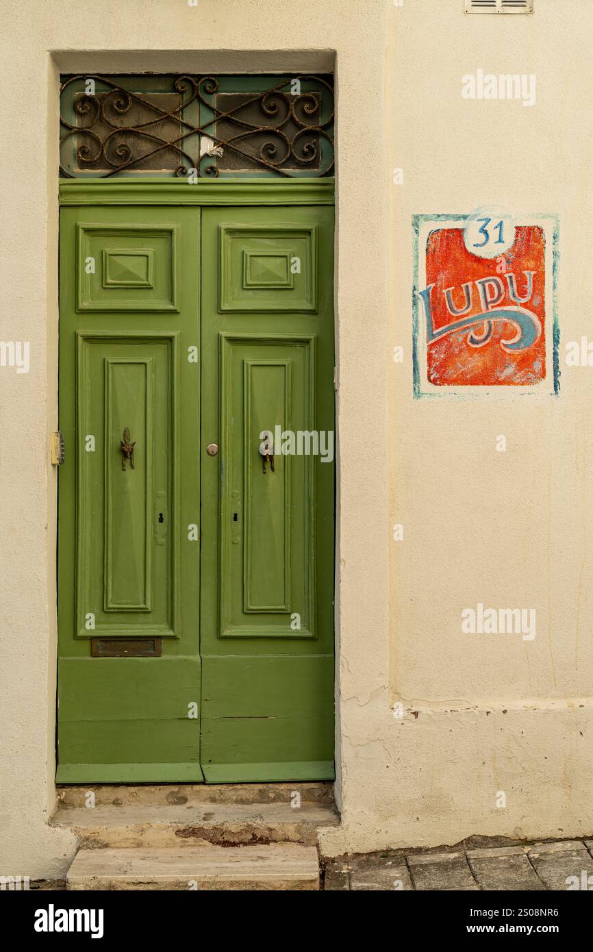 Traditional house detail in Malta. Limestone yellow bricks and colorful ...