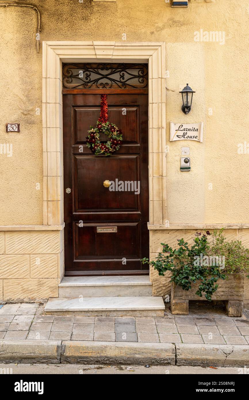 Traditional house detail in Malta. Limestone yellow bricks and colorful ...