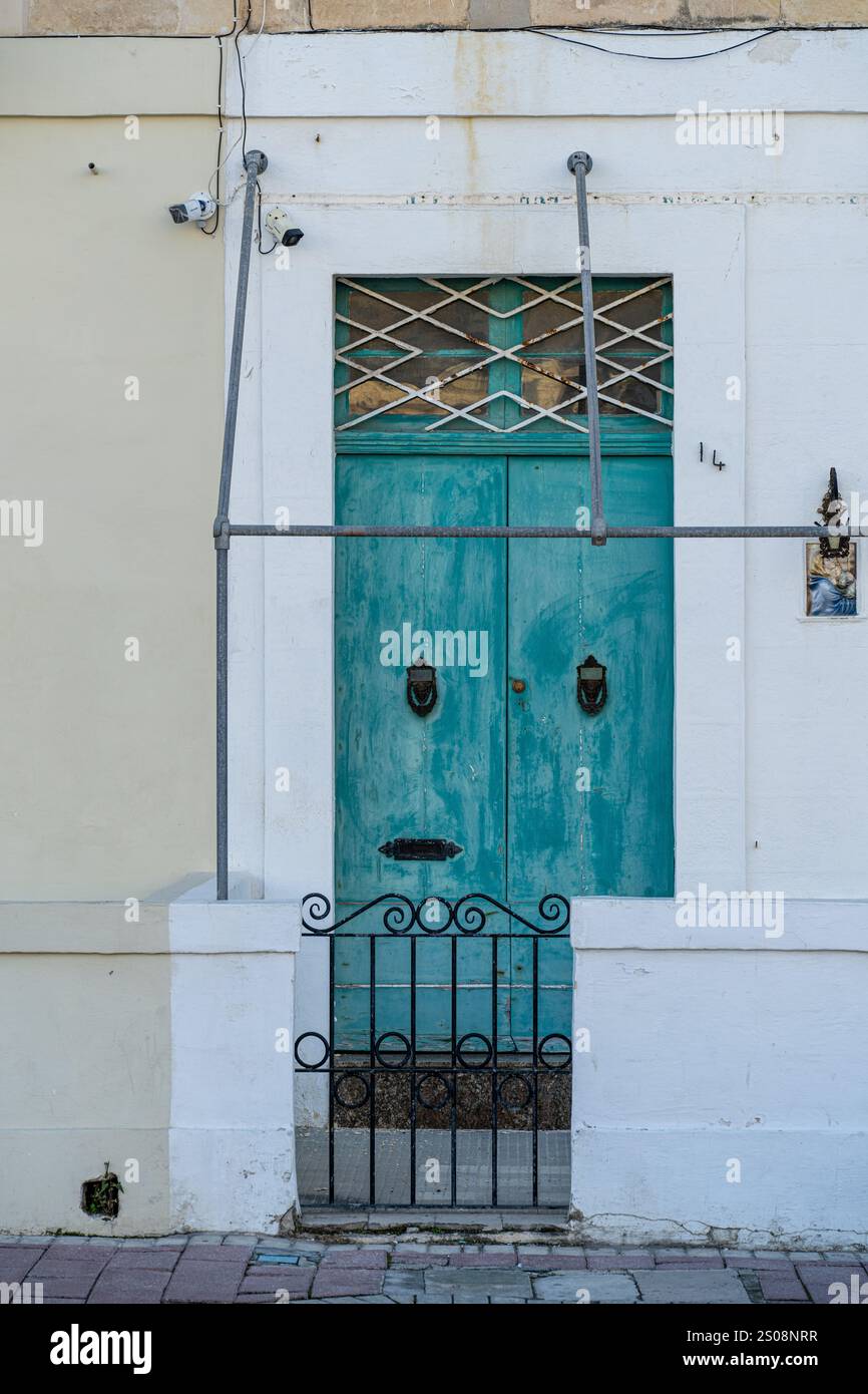 Traditional house detail in Malta. Limestone yellow bricks and colorful ...