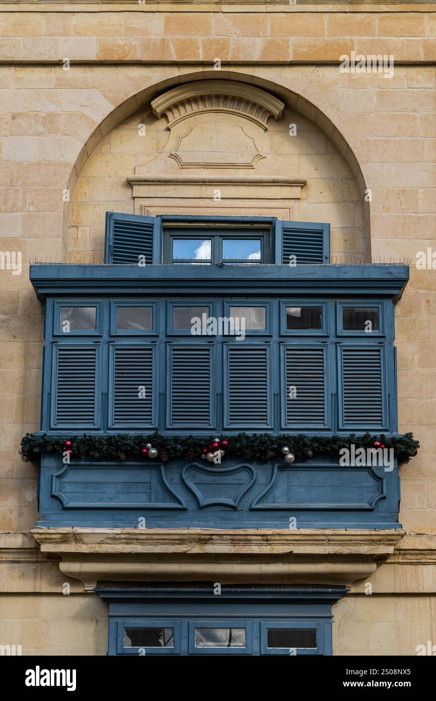 Traditional house detail in Malta. Limestone yellow bricks and colorful ...