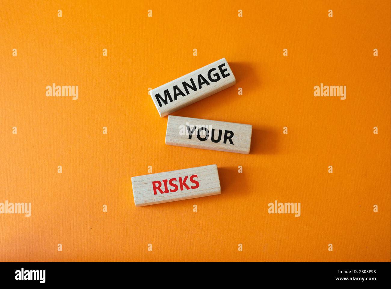 Manage your Risks symbol. Concept words Manage your Risks on wooden ...