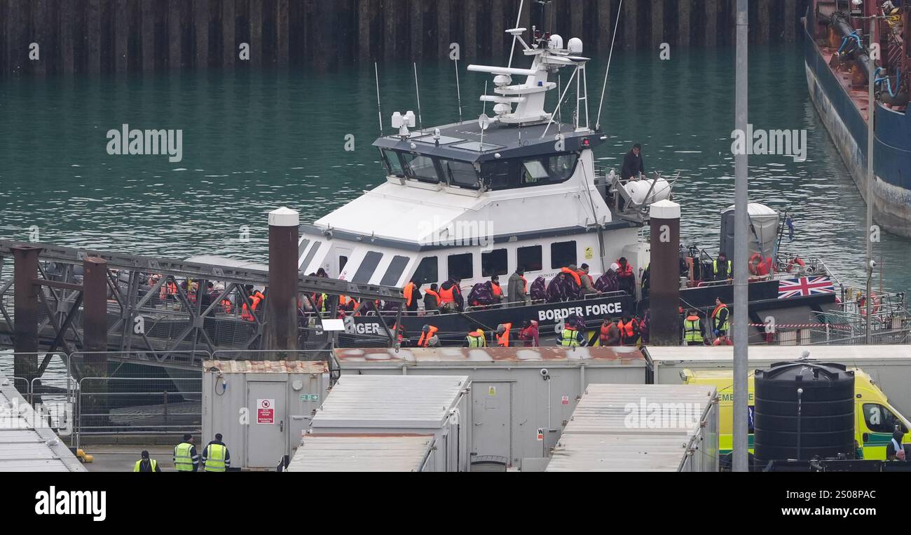 A group of people thought to be migrants are brought in to Dover, Kent, from a Border Force ...