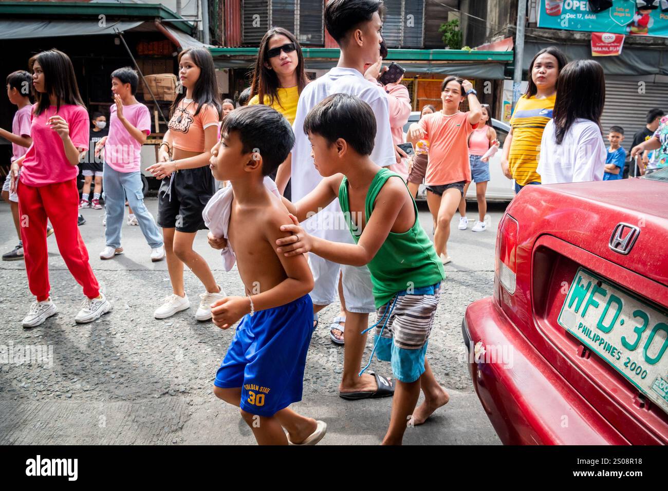 Filipino people celebrate an annual religious festival with a parade ...
