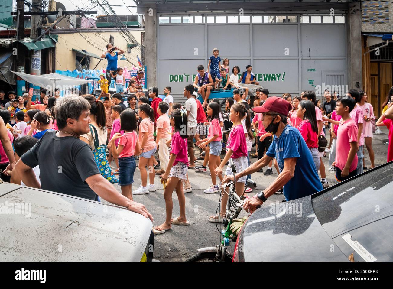 Filipino people celebrate an annual religious festival with a parade ...
