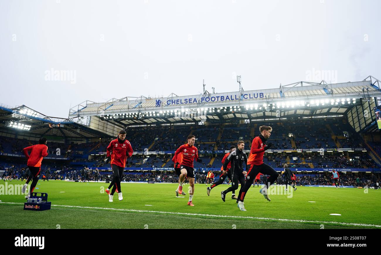 Fulham players warm up ahead of the Premier League match at Stamford ...