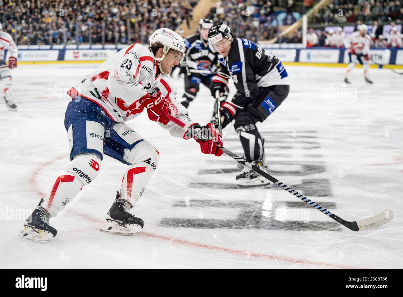 Sedlak Lukas, HC Pardubice, left, fights for the puck against Andreas Borgman, HC Fribourg ...