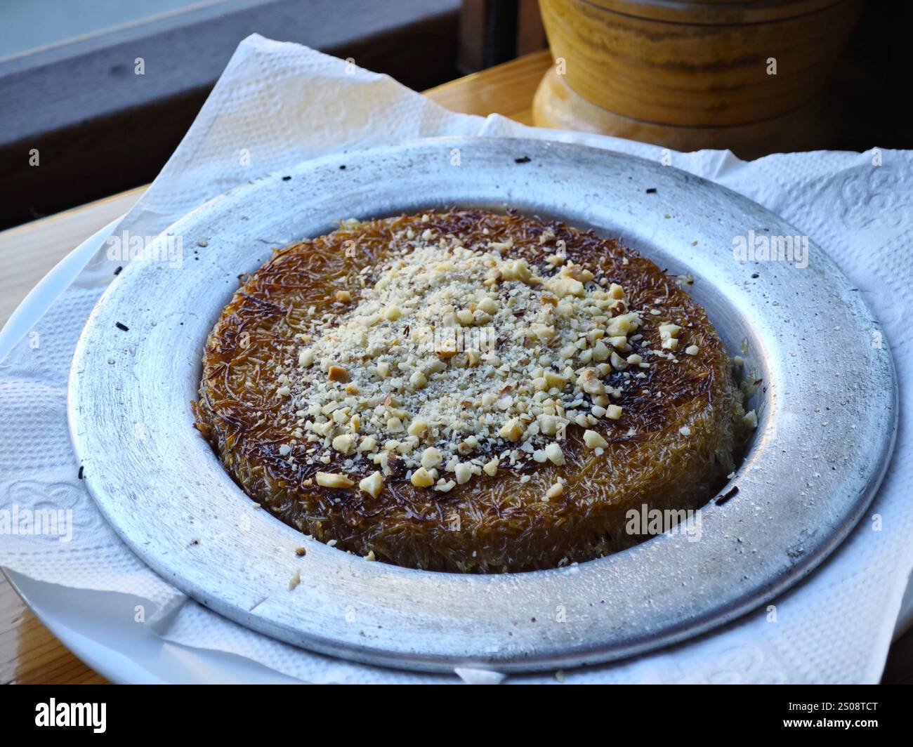 The traditional Turkish dessert, kunefe, is made from baked kadayif ...