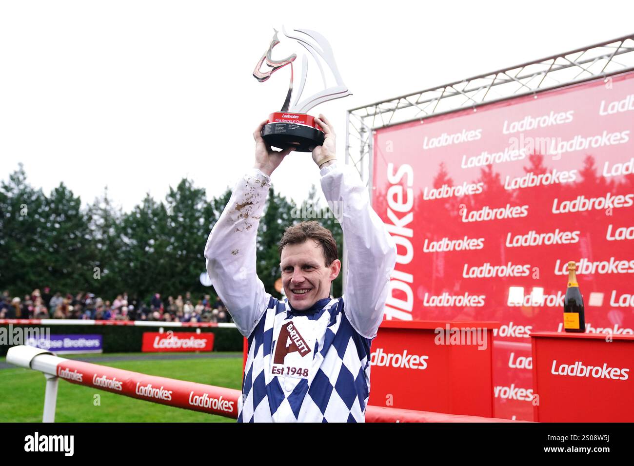 Jockey Paul Townend celebrates with the trophy after winning the ...