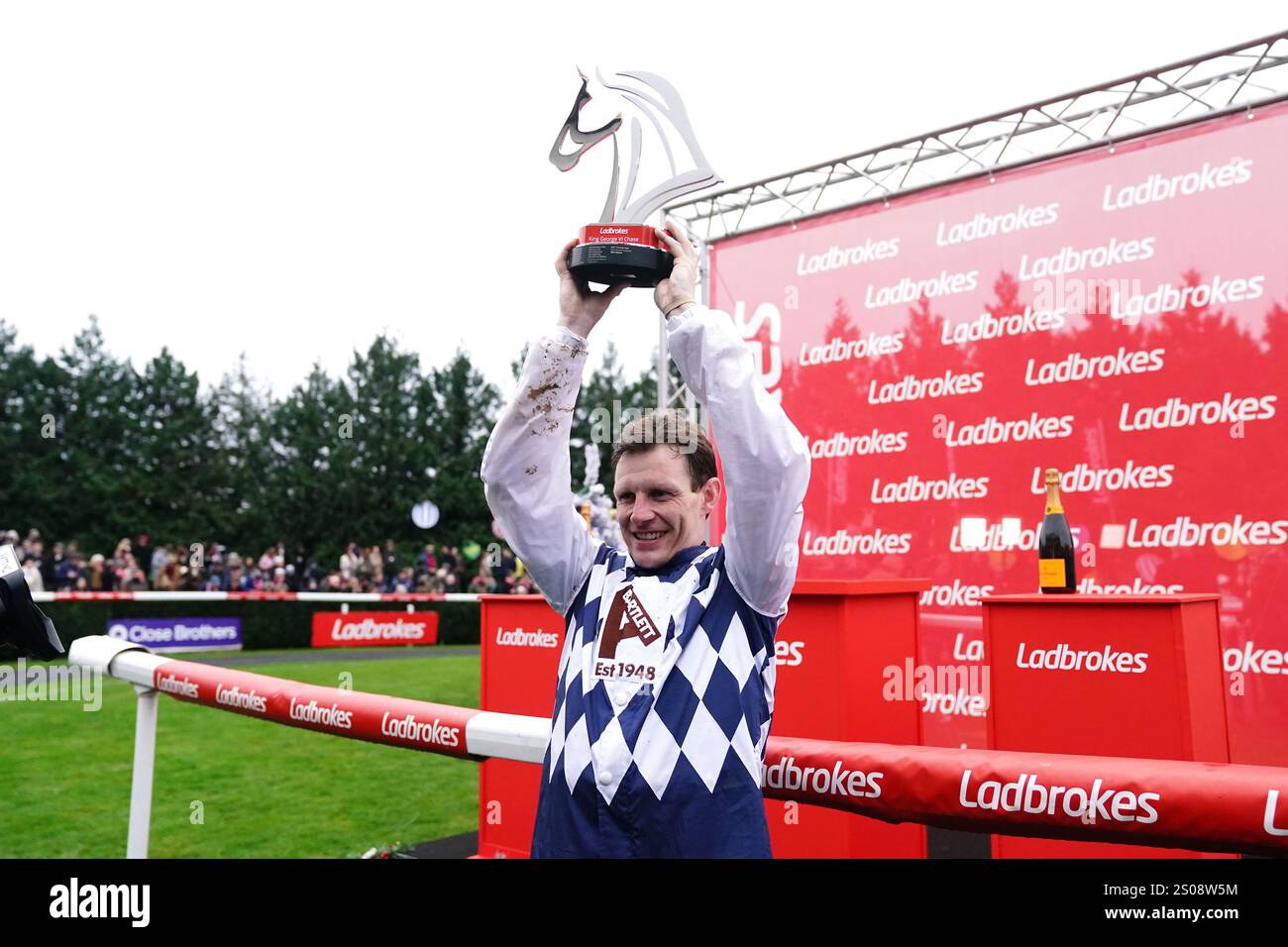 Jockey Paul Townend celebrates with the trophy after winning the ...