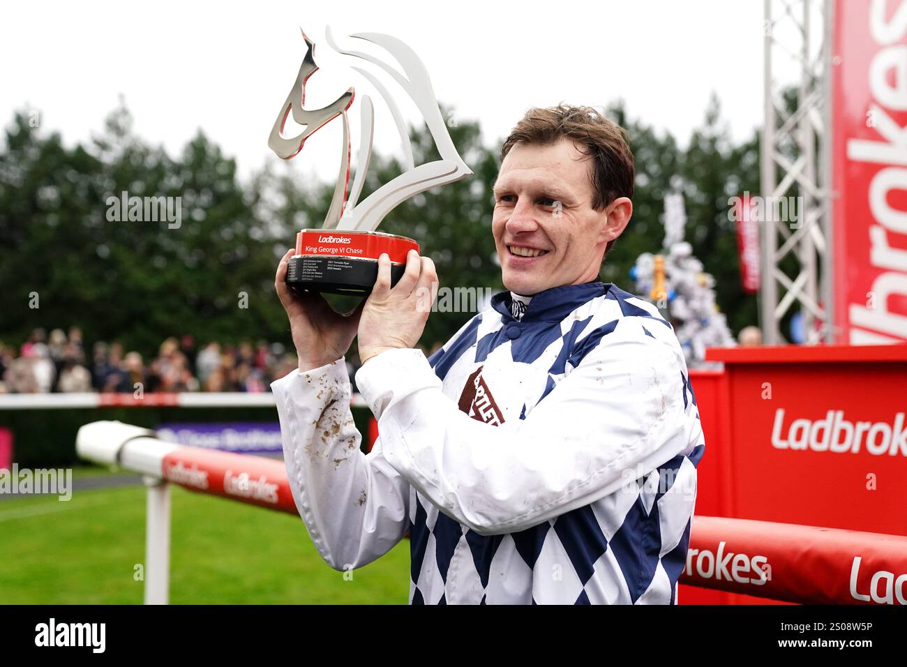 Jockey Paul Townend celebrates with the trophy after winning the ...