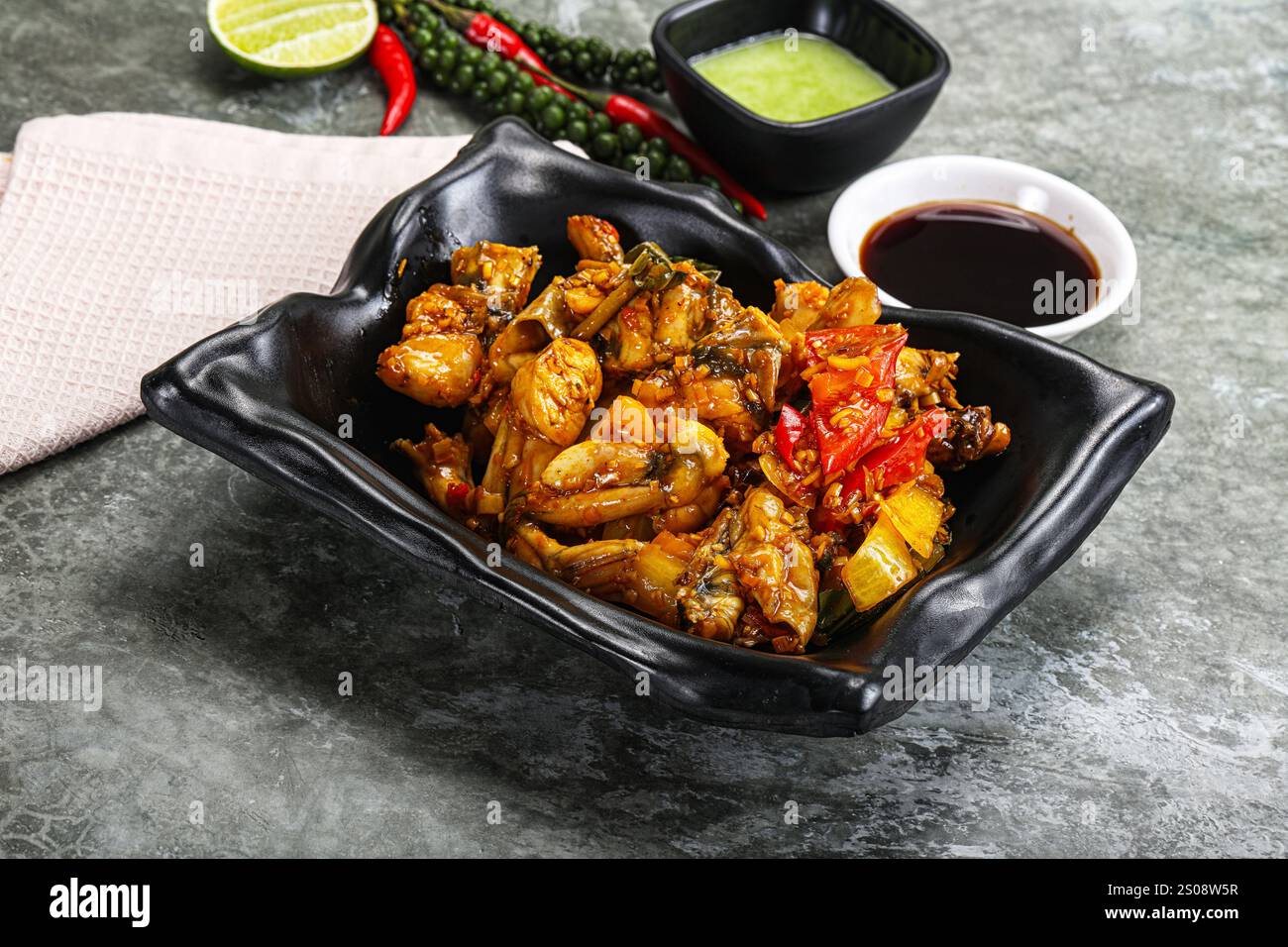 Vietnamese cuisine - fried frog with vegetables and spices Stock Photo ...