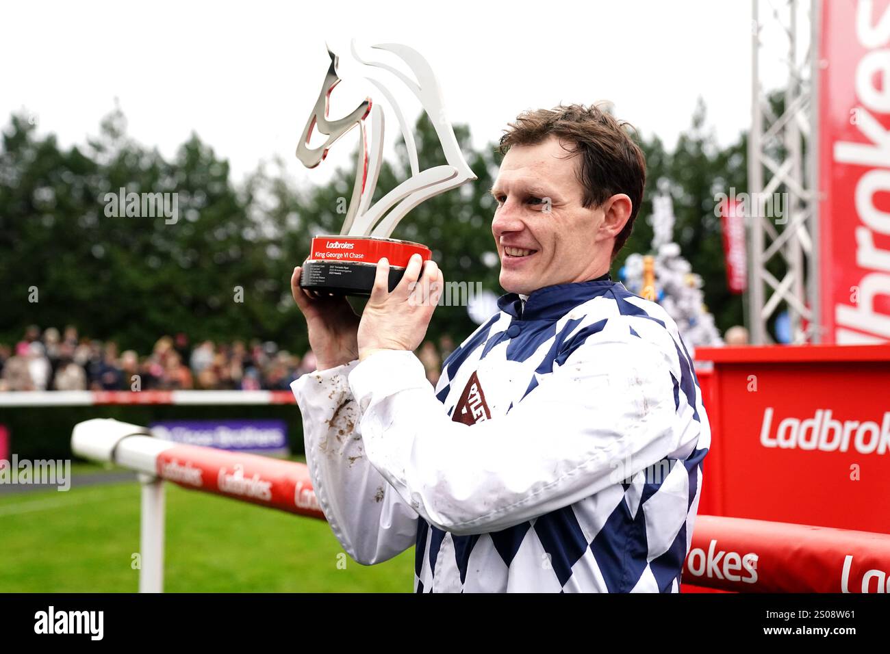 Jockey Paul Townend celebrates with the trophy after winning the ...