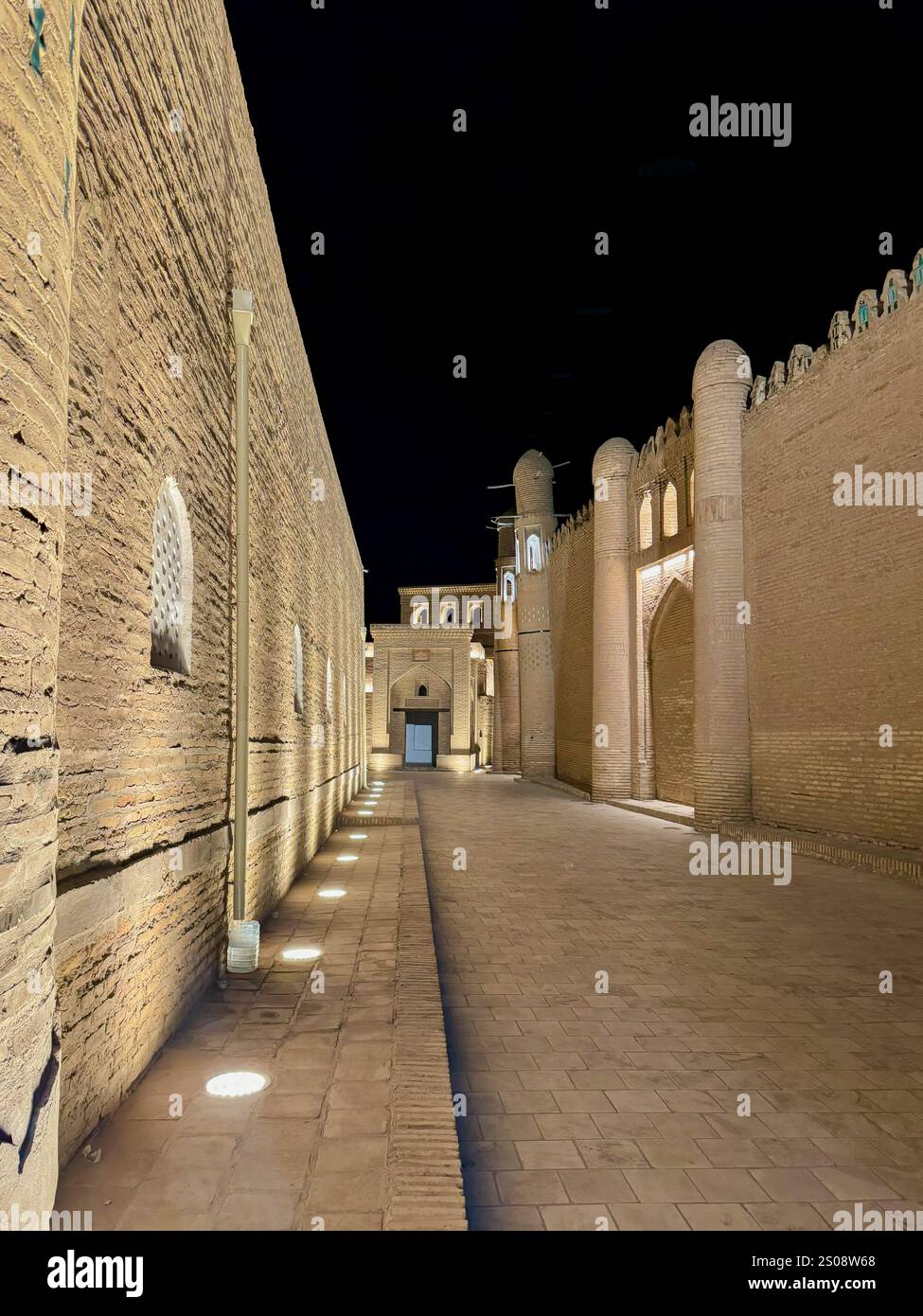Historic Night View of an Ancient Brick Wall and Gate Illuminated by ...