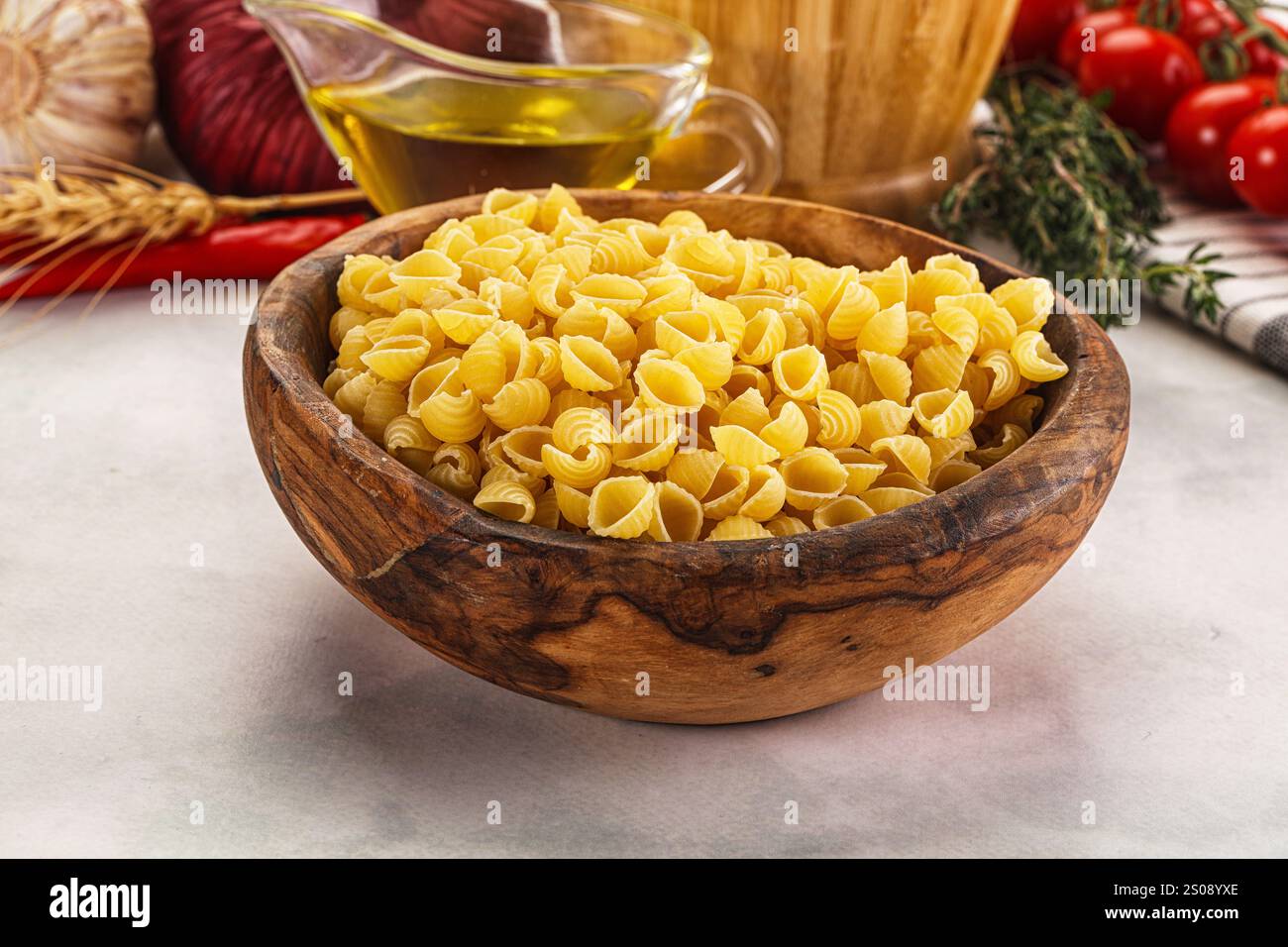 Italian cuisine - dry conchiglie shell pasta Stock Photo - Alamy