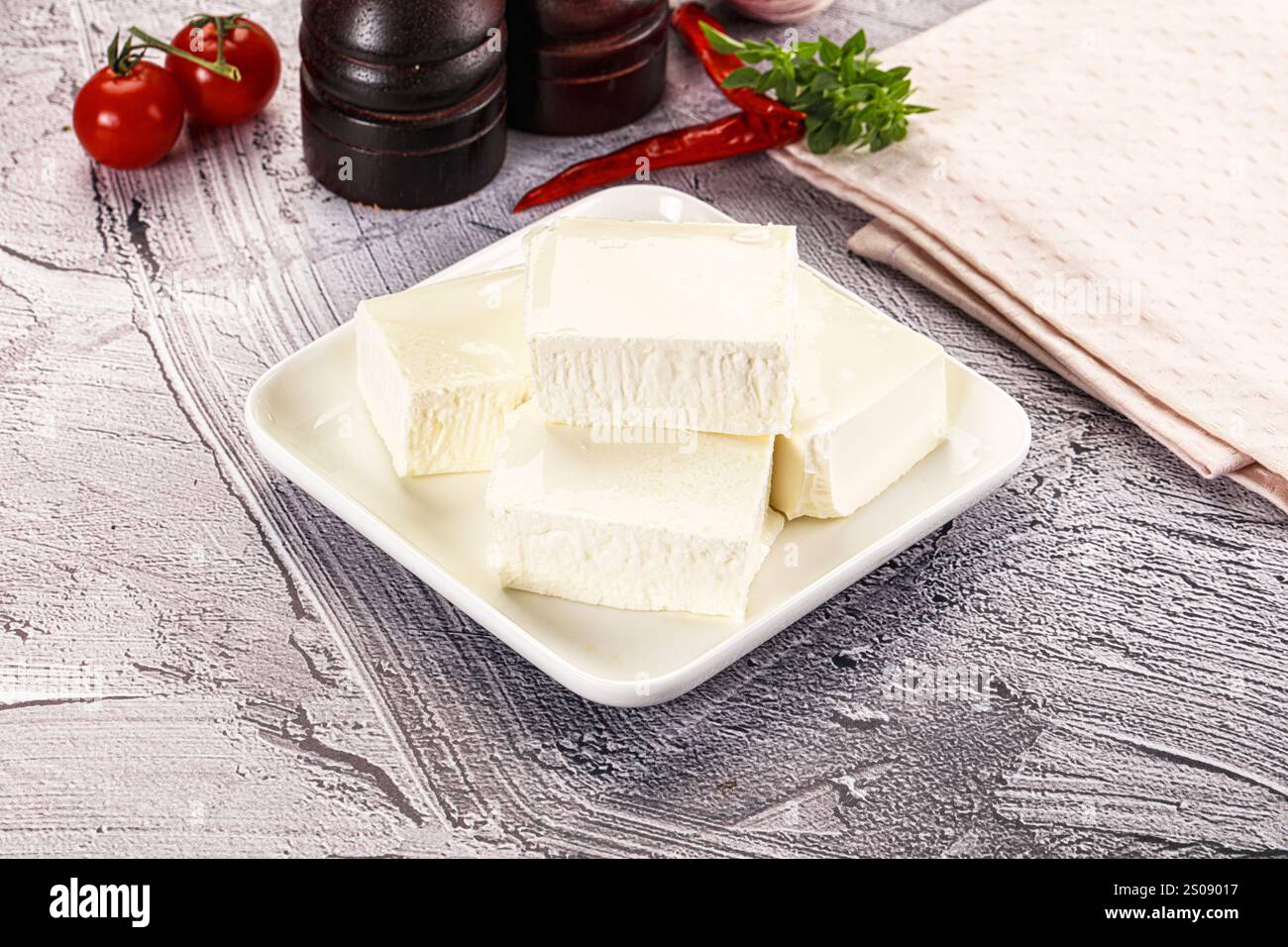 Greek traditional cuisine - Feta cheese bricks Stock Photo - Alamy