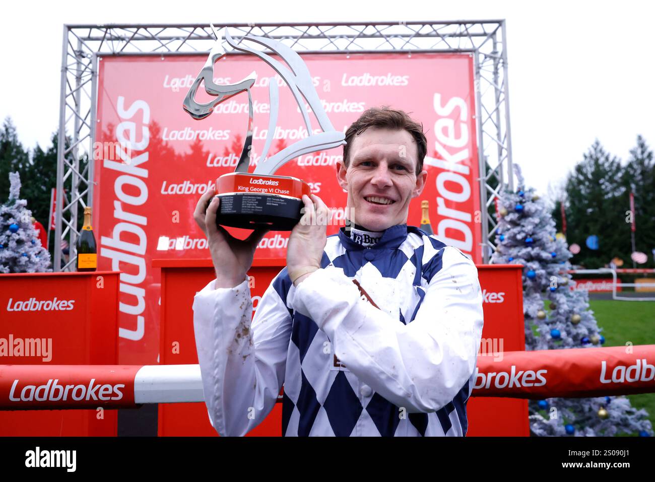 Jockey Paul Townend celebrates with the trophy after winning the ...