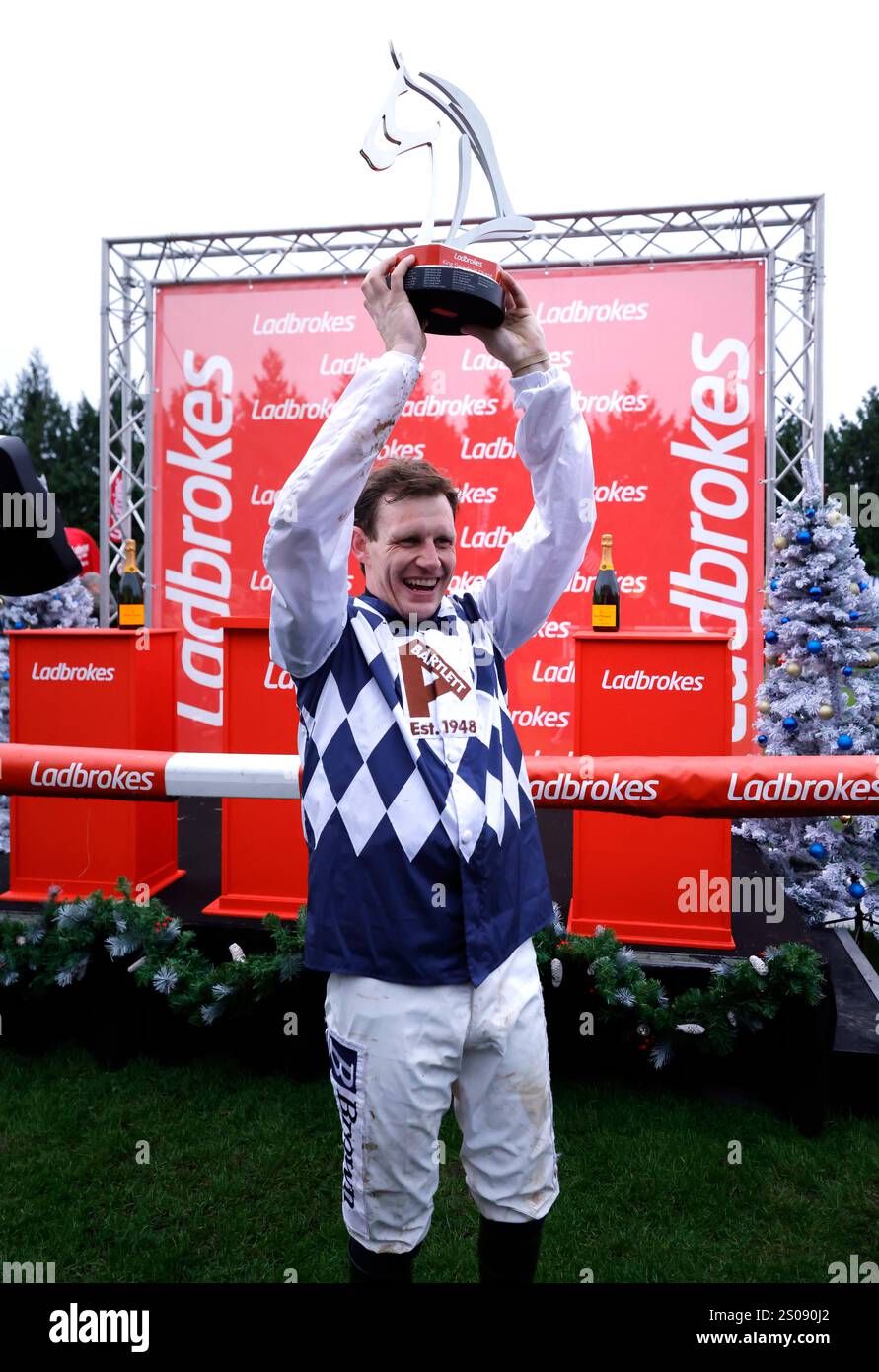 Jockey Paul Townend celebrates with the trophy after winning the ...