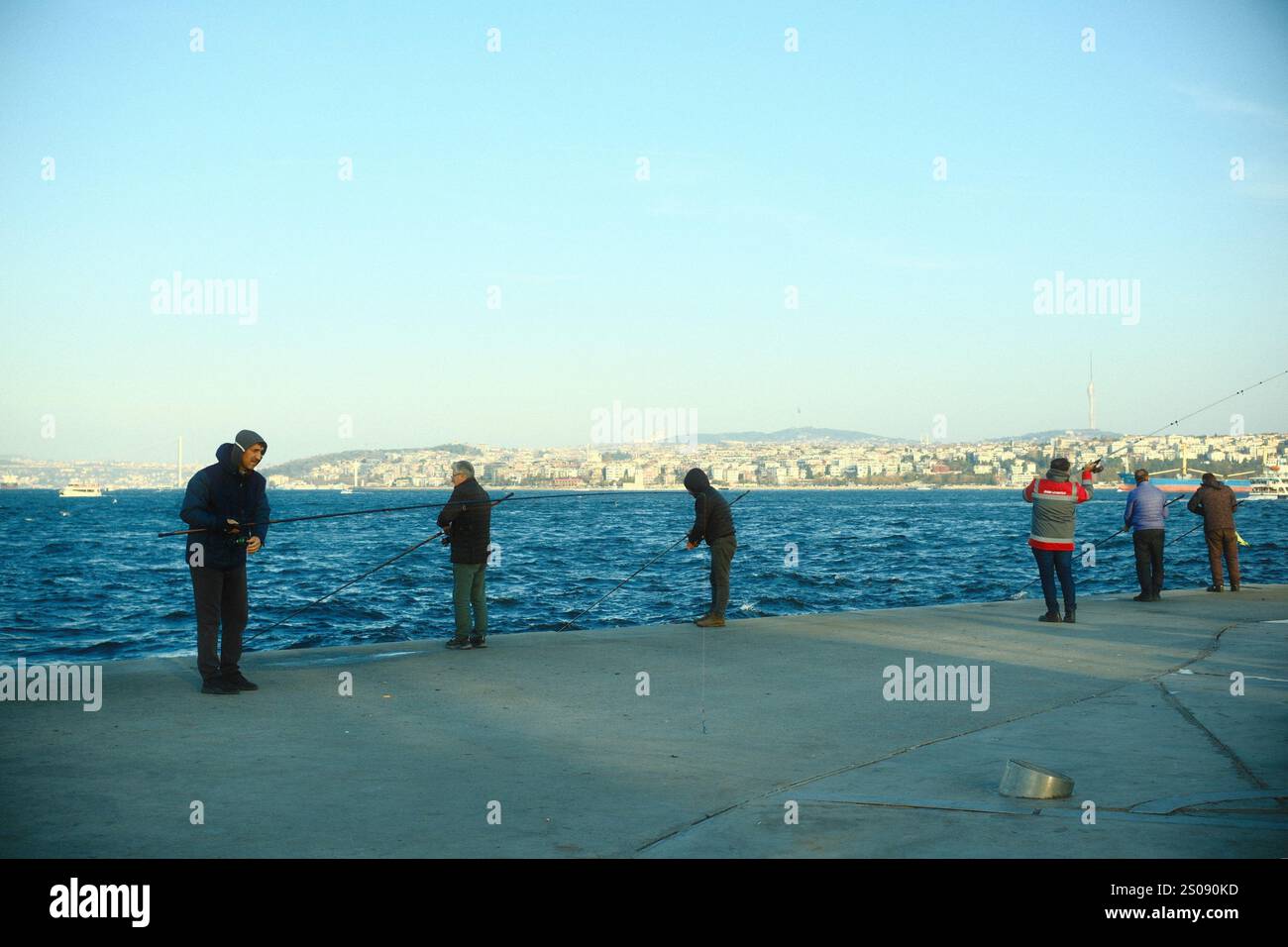 Bosphorus, Istanbul, Türkiye - November 30, 2024: Turkish men fishing ...