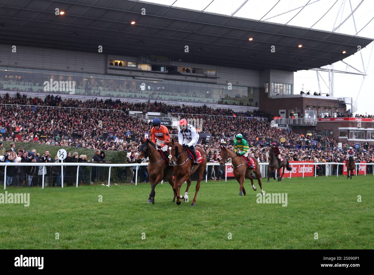 Jockeys and horses before the Ladbrokes King George VI Chase on King ...