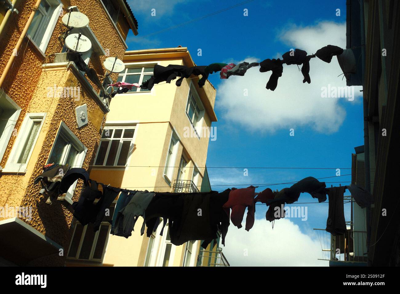 Laundry dried on clothesline between hi-res stock photography and ...