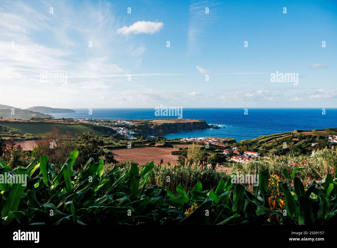 Coastal view over the north side of Sao Miguel island, traveling at ...