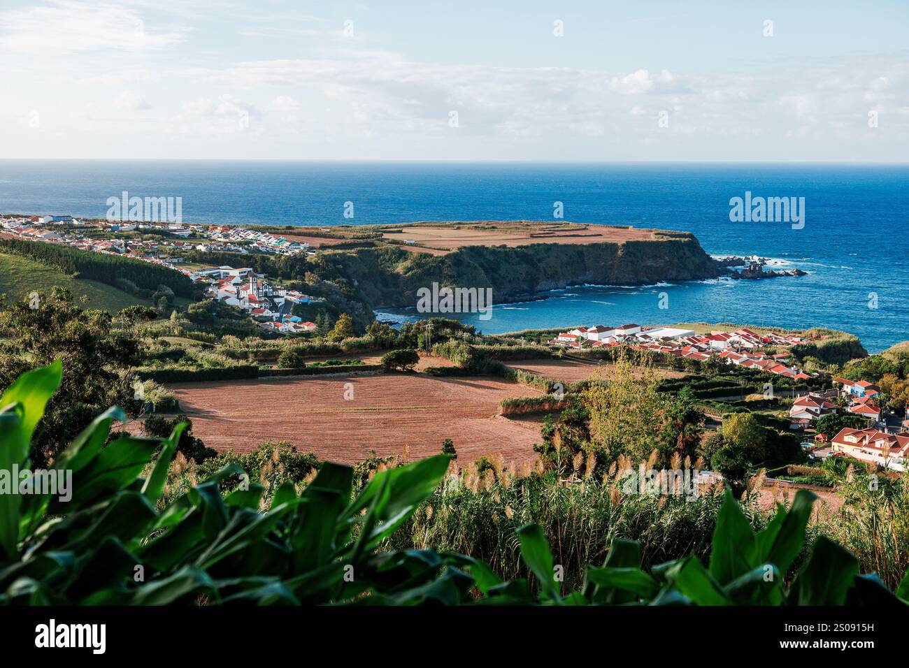 Coastal view over the north side of Sao Miguel island, traveling at ...