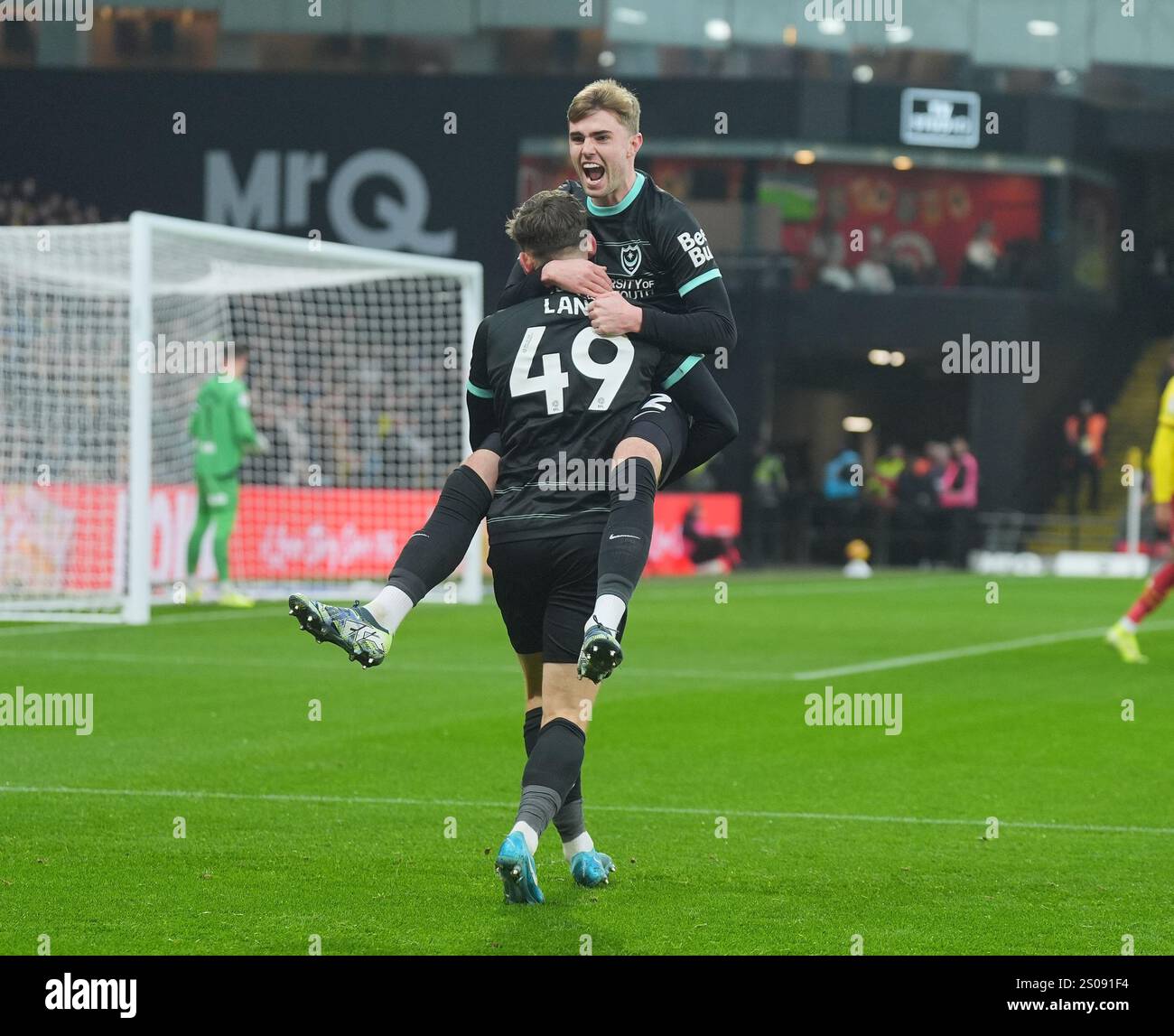 Portsmouth's Zak Swanson (top) celebrates with teammates after scoring ...