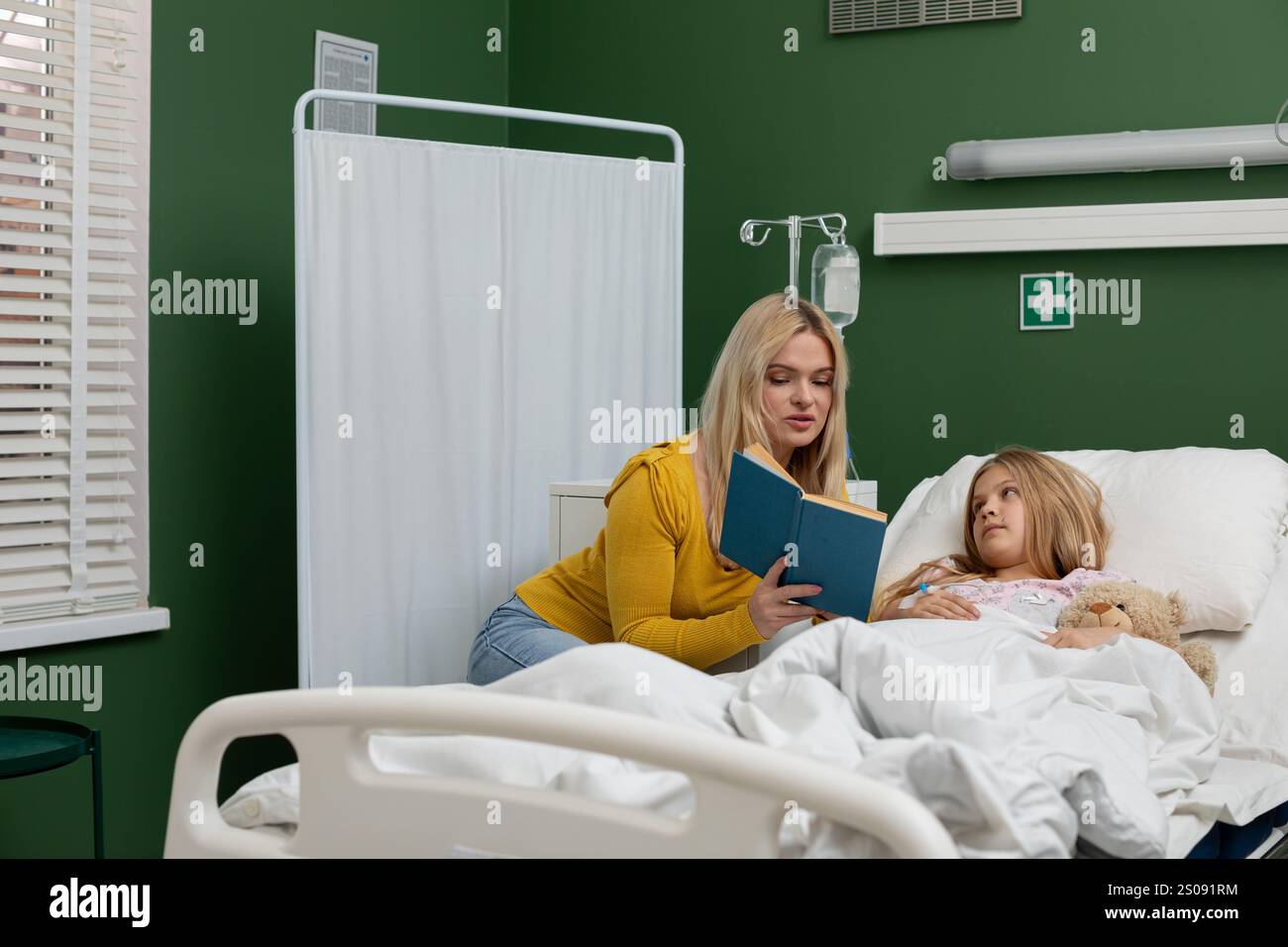 A Beautiful Caring Moment in the Hospital Reading a Story to a Patient ...