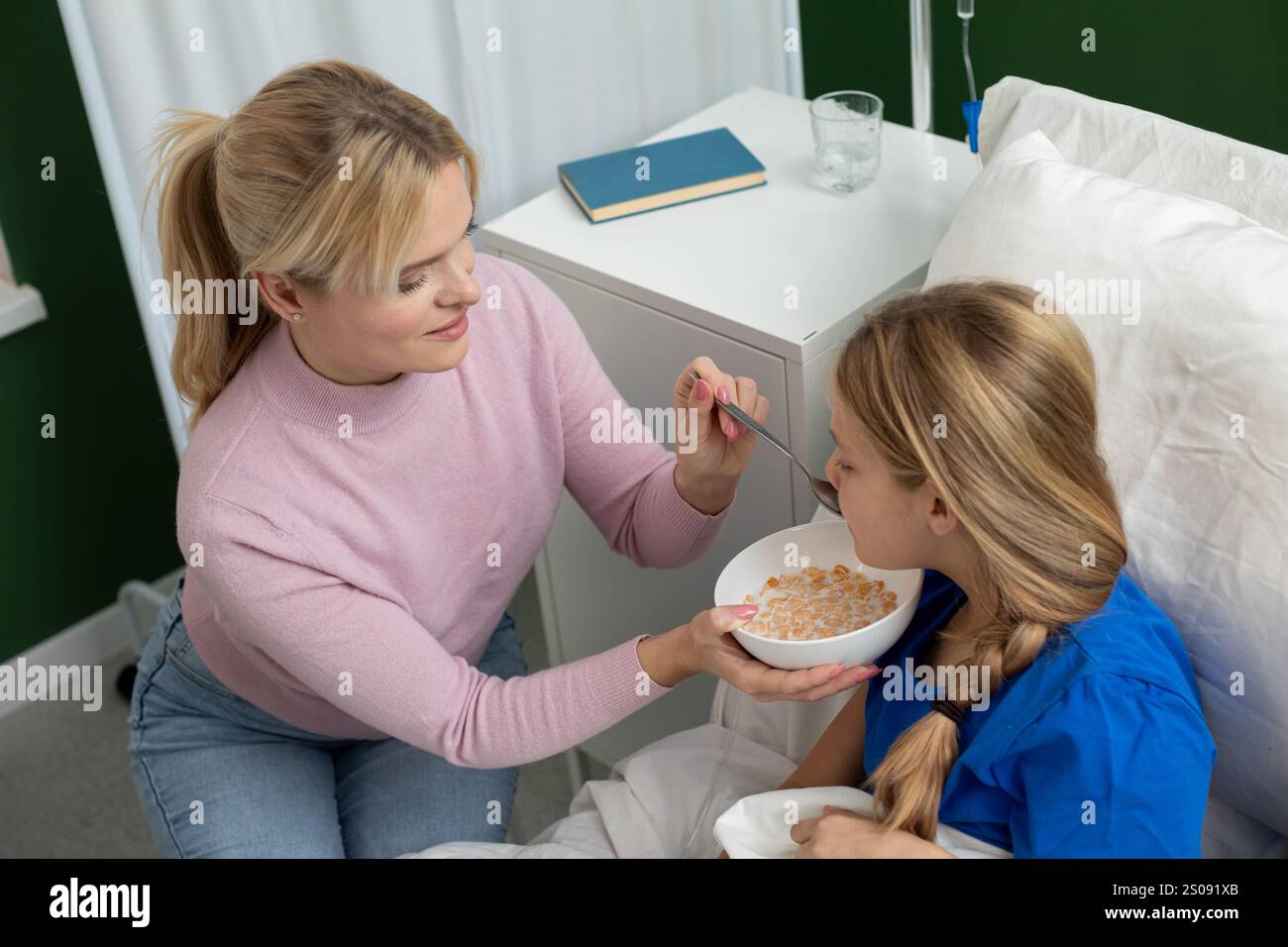 Nurturing Care Providing Comfort and Feeding a Child in a Hospital Bed ...