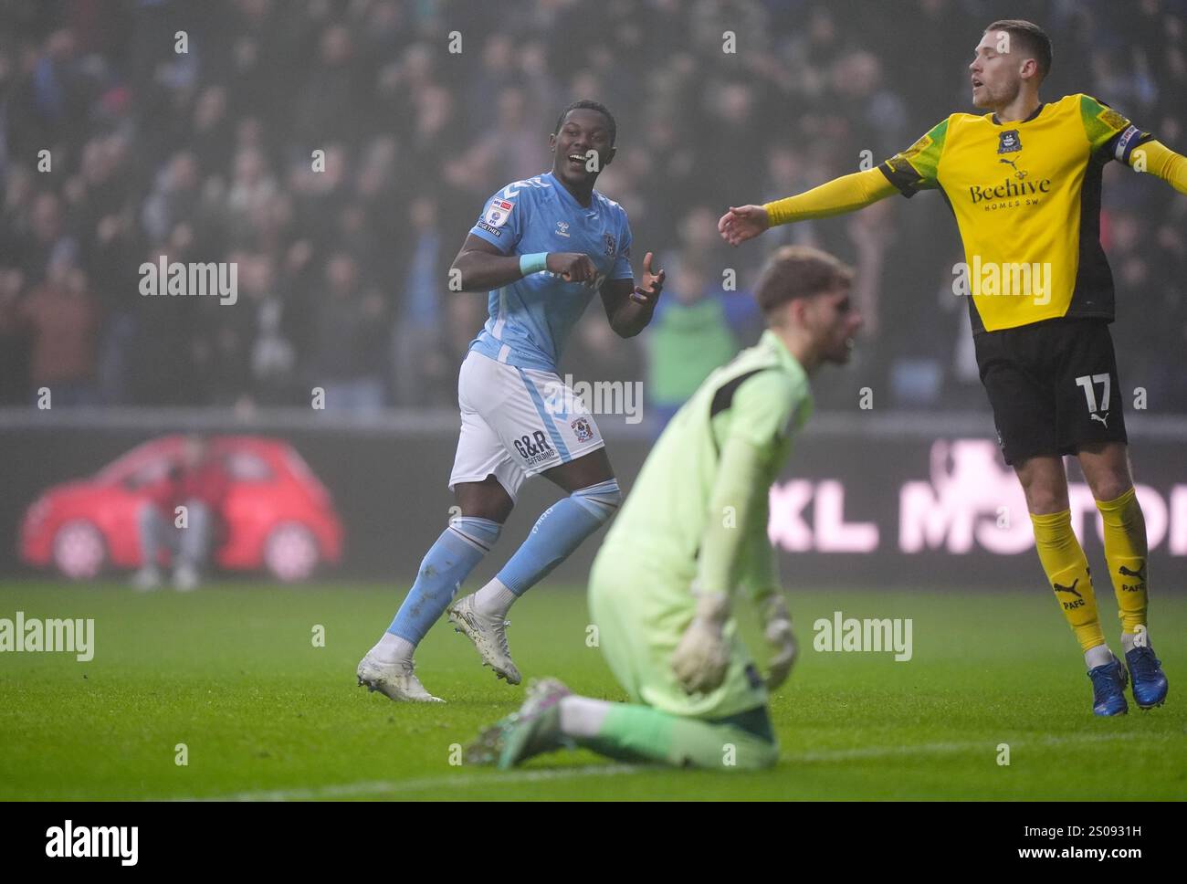 Coventry City's Ephron Mason-Clark (left) celebrates after scoring his ...