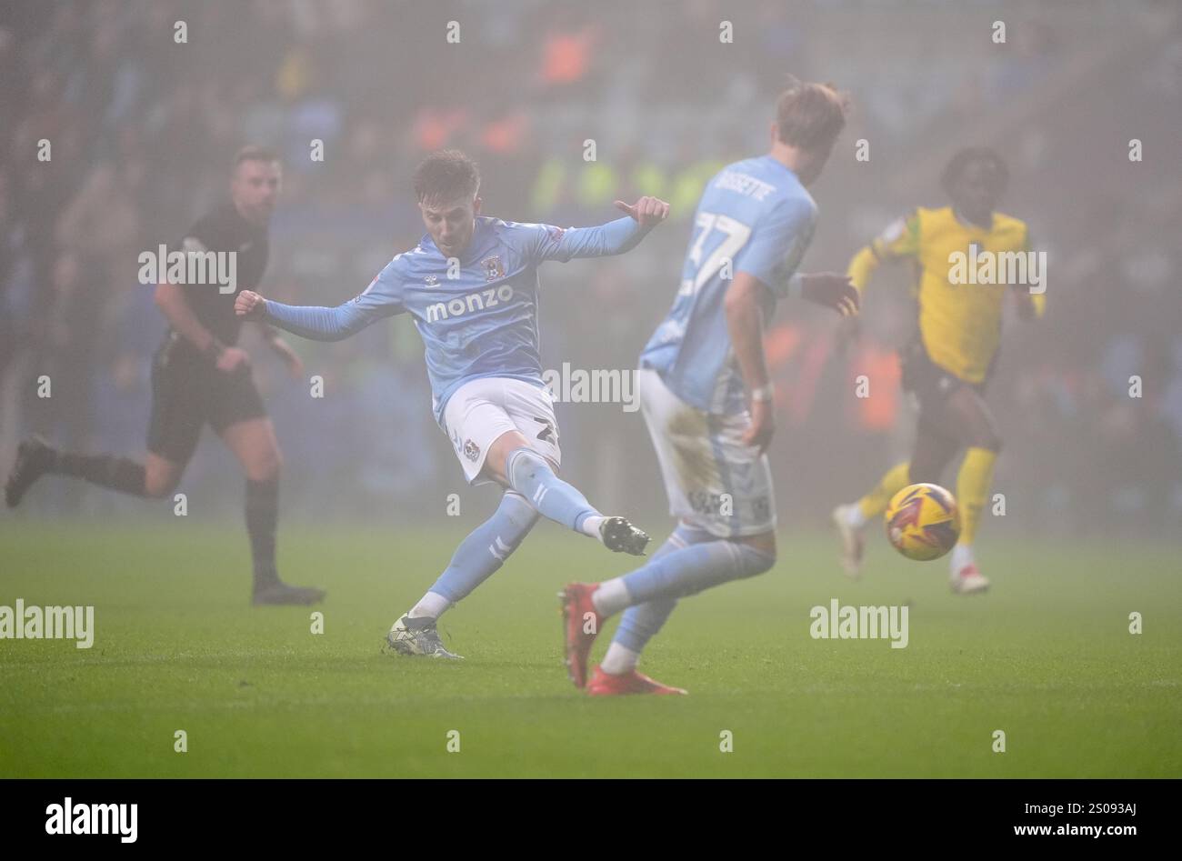 Coventry City's Josh Eccles (left) scores his sides fourth goal during ...
