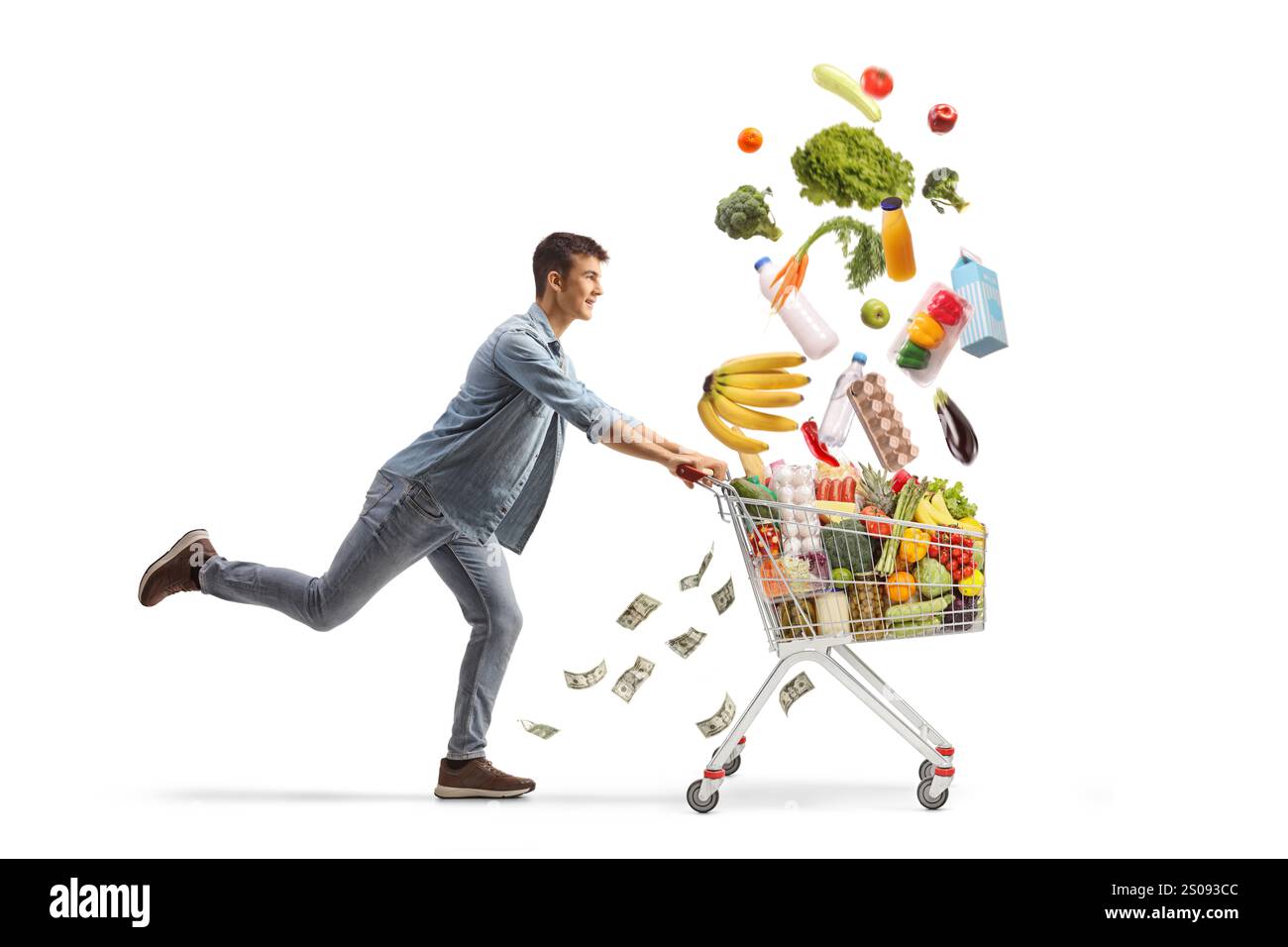 Male teenager running with flying food in a shopping cart and money ...