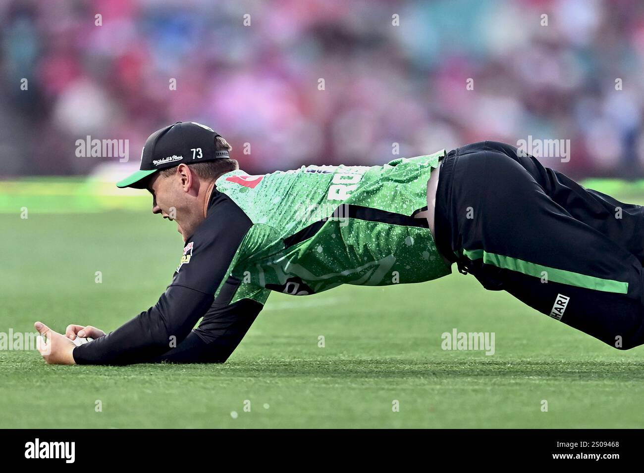 Sydney, Australia. 26th Dec, 2024. Tom Rogers of Melbourne Stars dives ...