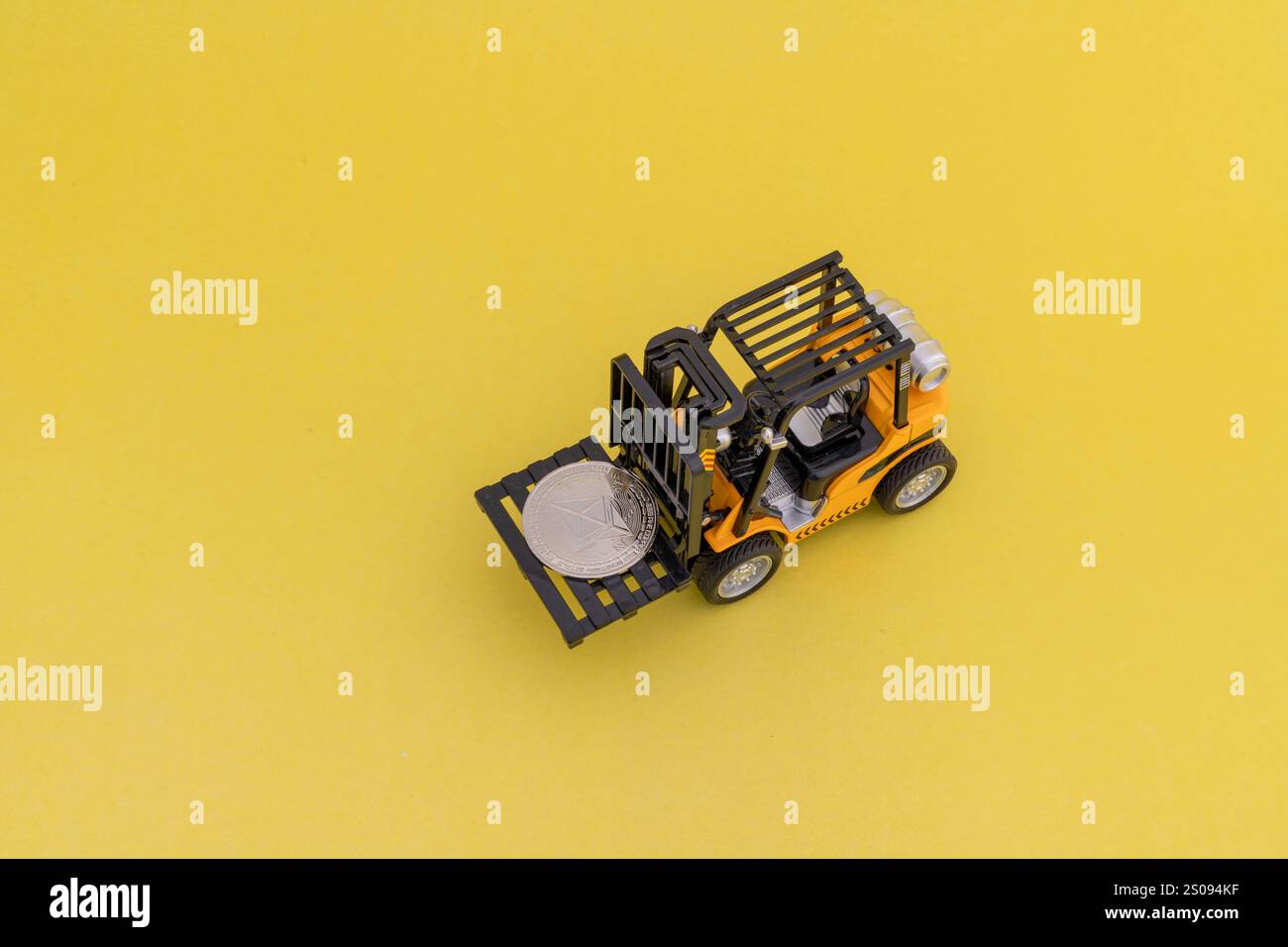 Miniature yellow forklift truck lifting hi-res stock photography and ...