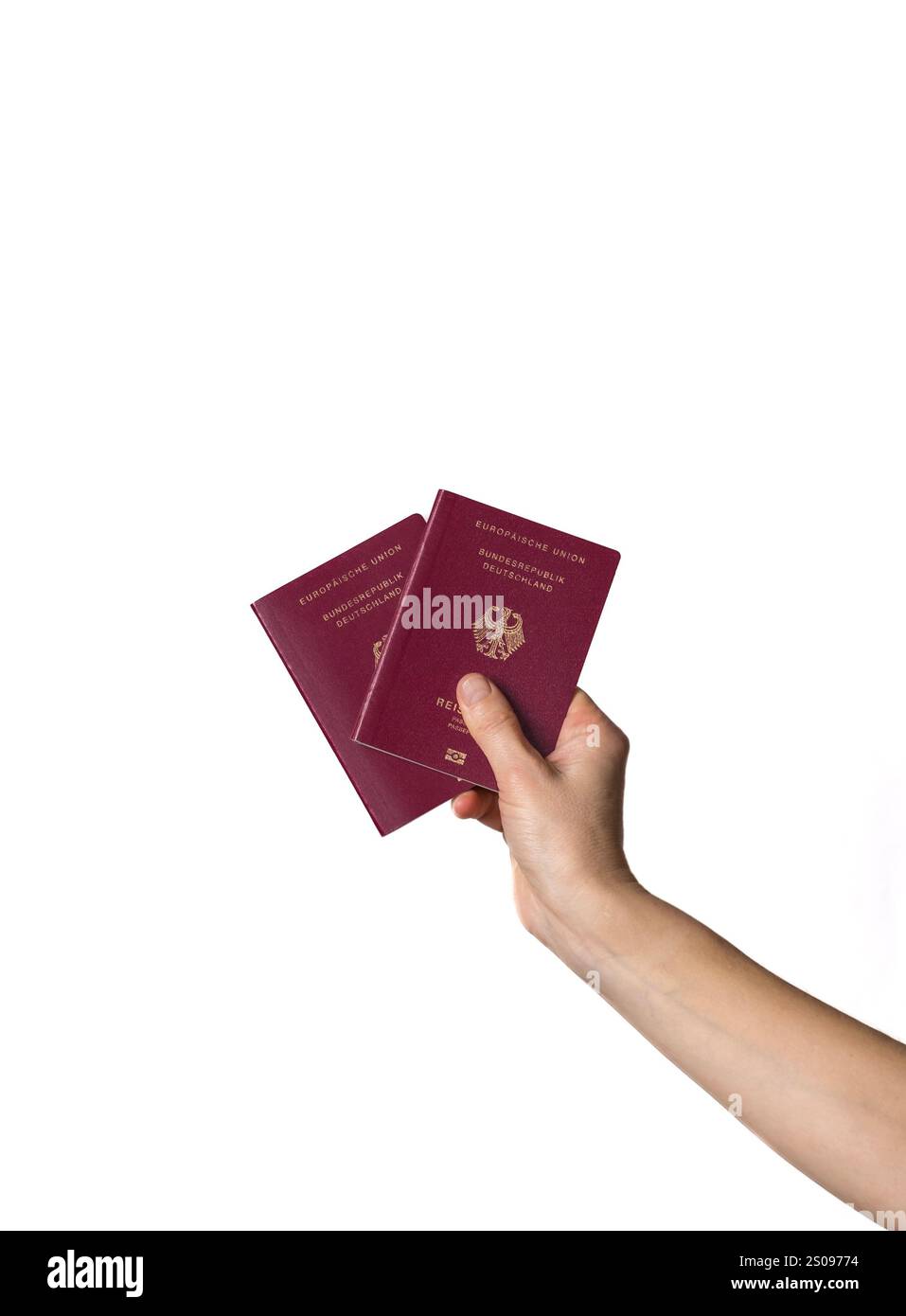 A close-up shot of a hand holding a German passport with a clean white ...