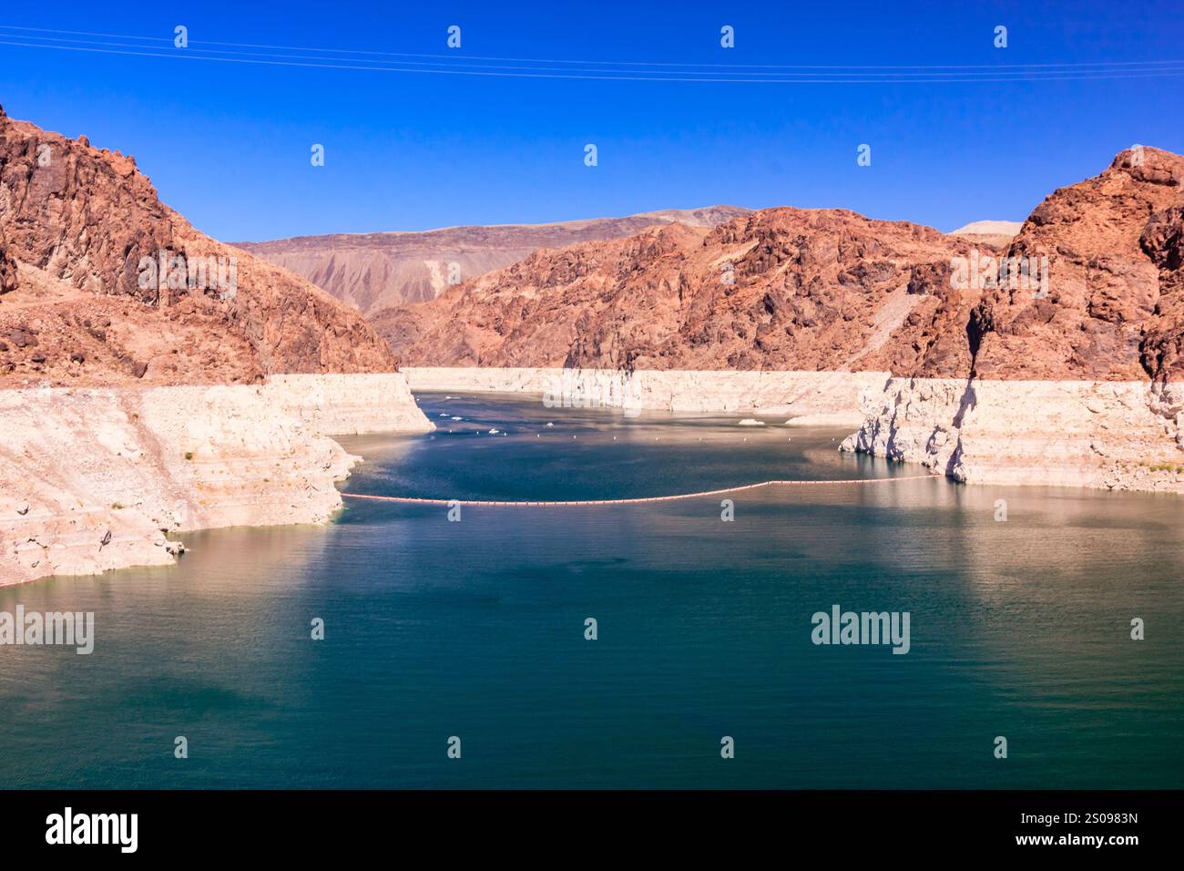 A beautiful blue river flows through a canyon. The water is calm and ...