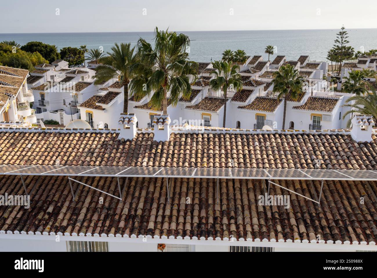 Photo of a typical Spanish apartment block and houses showing the ...