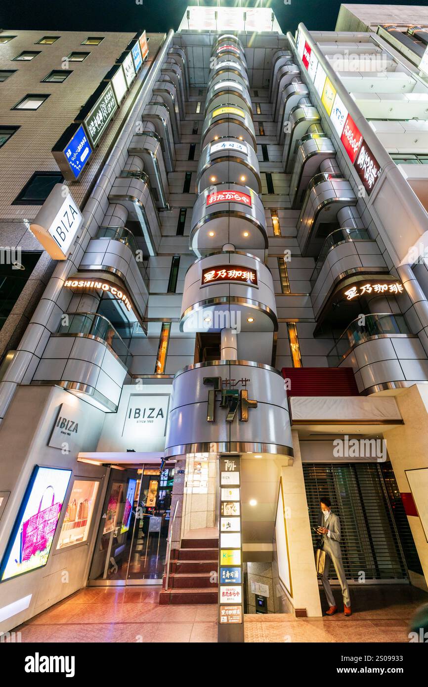 The Ginza Sanwa building with its distinctive shape and balconies. Wide ...